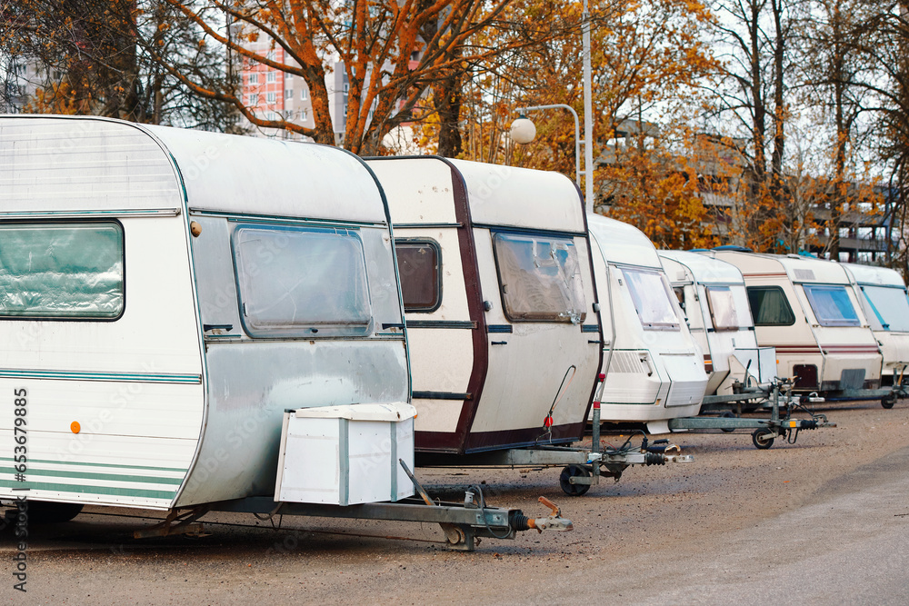 Fifth wheel travel trailers parked on parked lot in the city. Camping ...