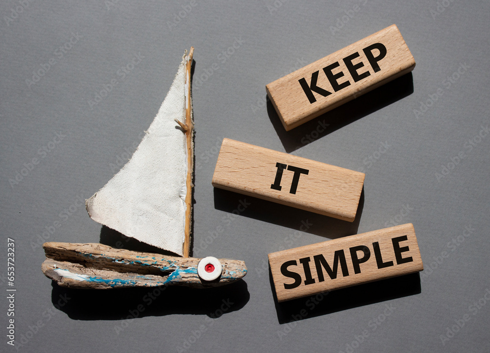 Keep it Simple symbol. Concept words Keep it Simple on wooden blocks ...