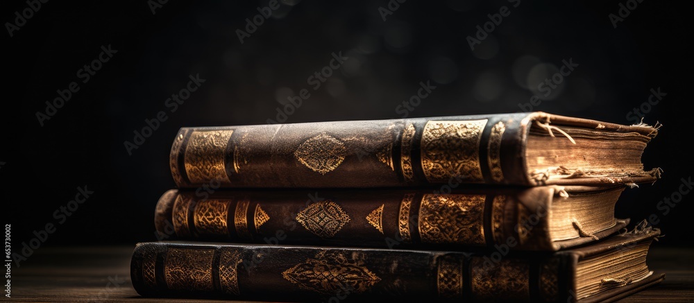 Old Jewish books with worn leather binding and a blurred open Torah in ...