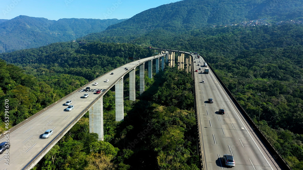 Aerial landscape of landmark highway road at green forest trees and ...