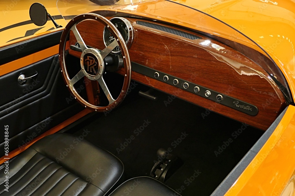 Vintage wooden interior, retro driving wheel and round analogue styled ...