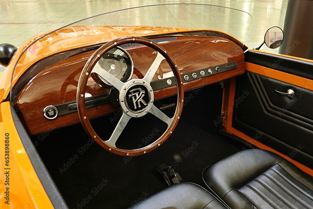 Elegant wooden interior, retro driving wheel and round analogue styled ...