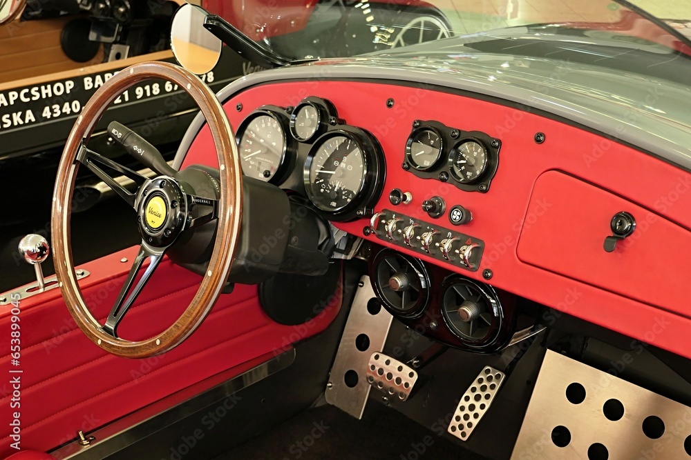 Foto de Driver seat, steering wheel and vintage red dashboard of ...