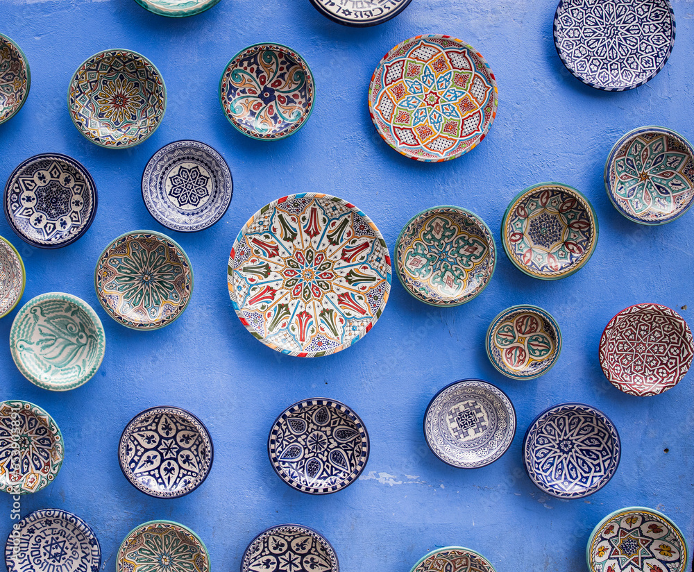 Moroccan plates on the blue walls of Chefchaouen Morocco Stock Photo ...