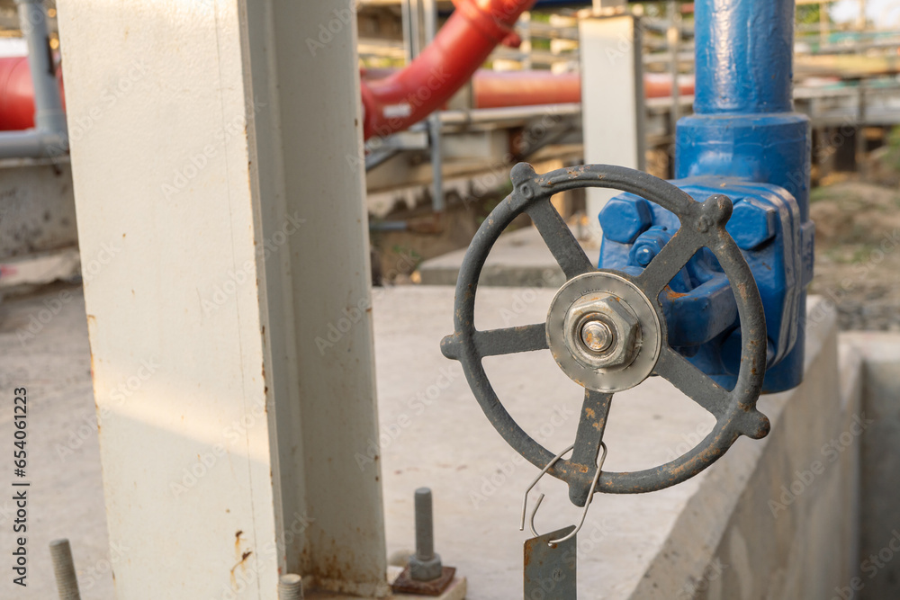 Manual gate valve on the water distribution pipe line on the power ...