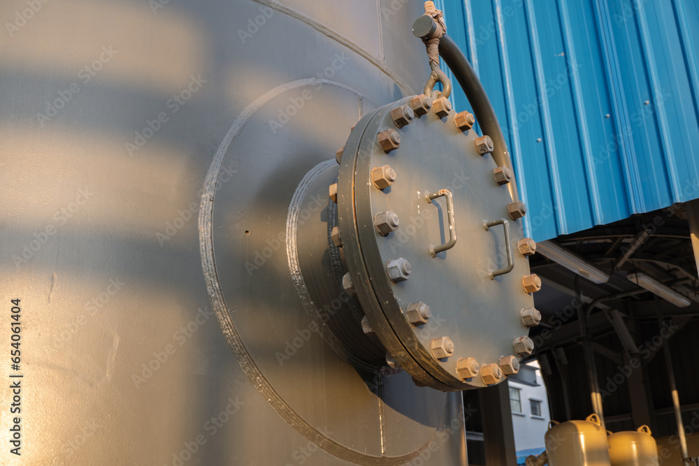 Man hole of tank and bona pipe on the power plant project. The photo is ...