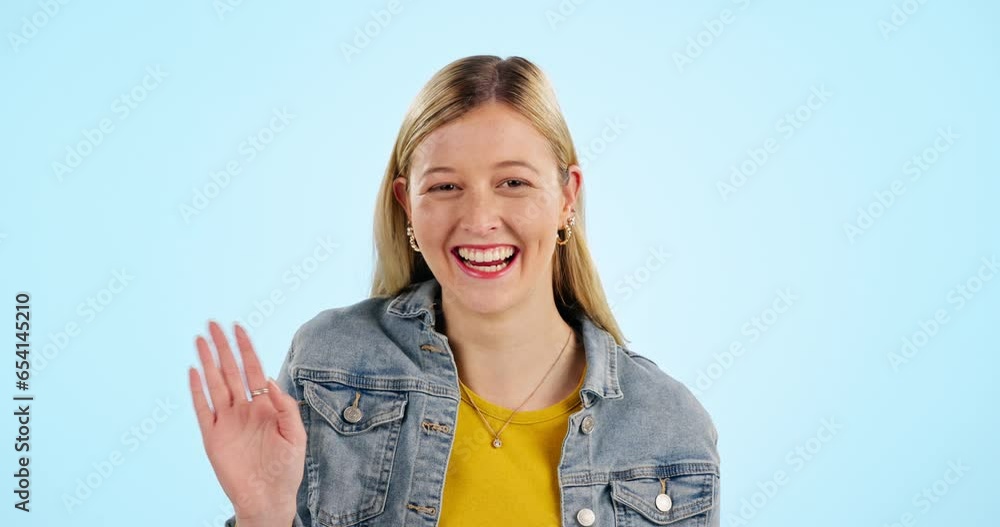 Face, wave hand and excited woman in studio isolated on blue background ...