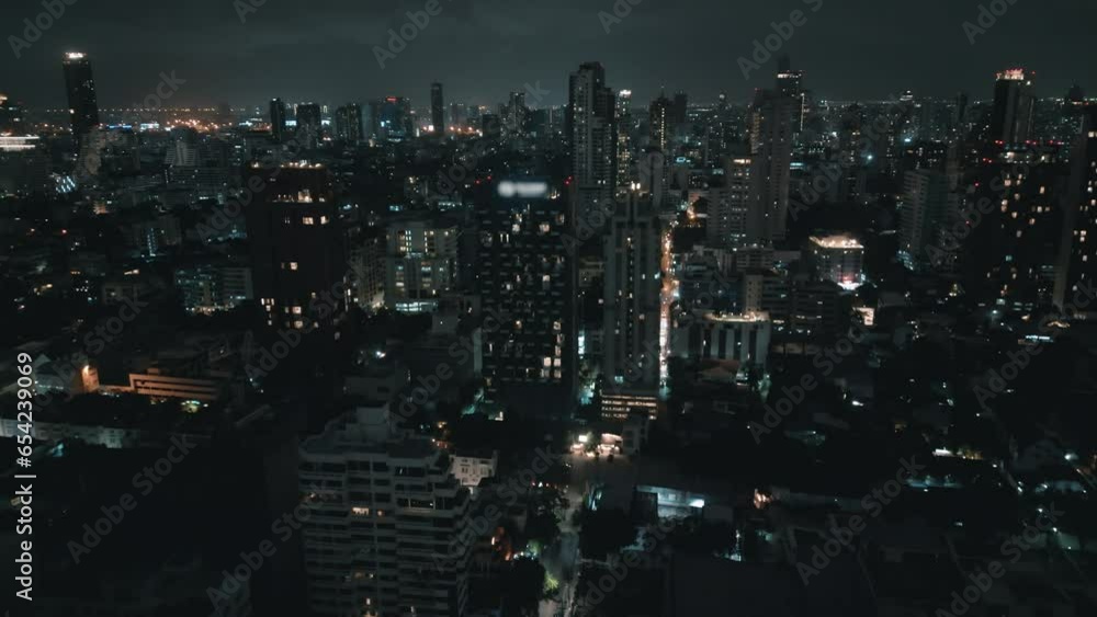 City night footage. Cinematic nighttime metropolis with towering ...