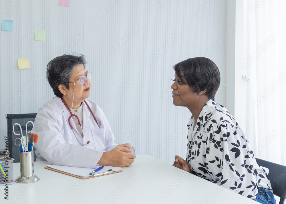 Asian senior elderly 60s physician wearing lab coat and stethoscope ...
