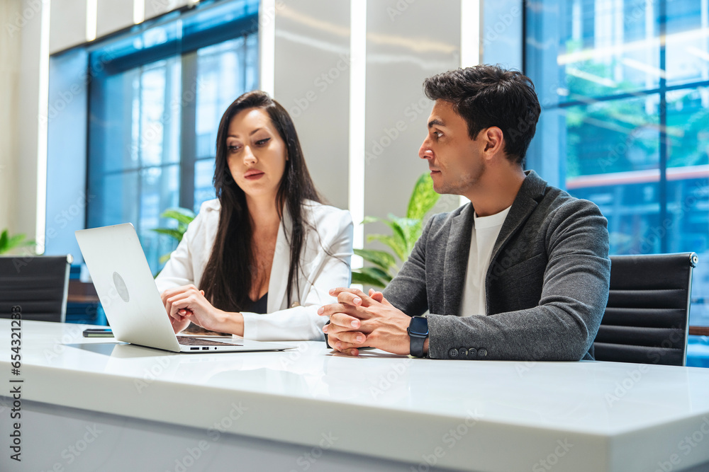 Staff team work together female employee sitting and explaining data ...