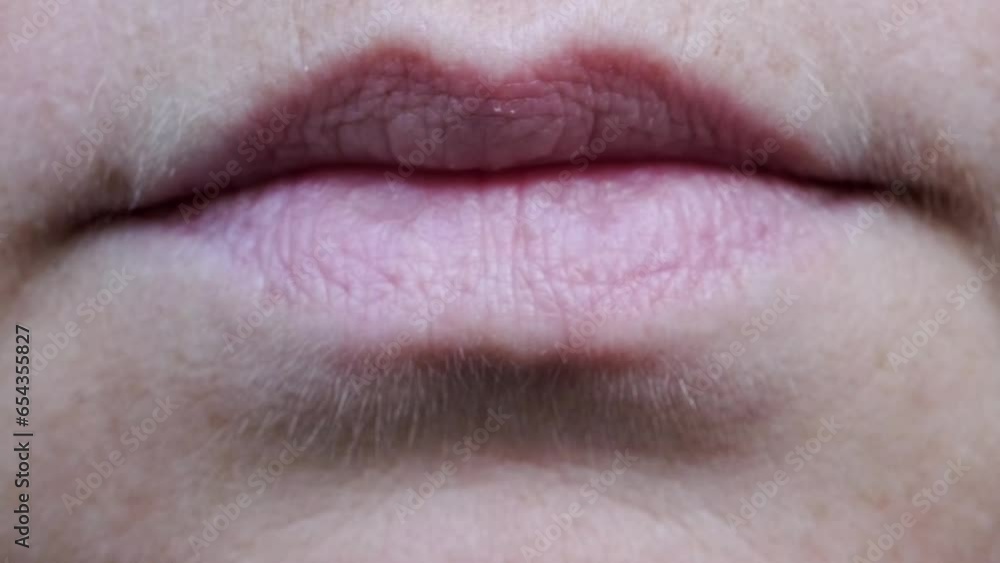 mouth, lips close up, mature female face, woman 50-55 years old looks ...