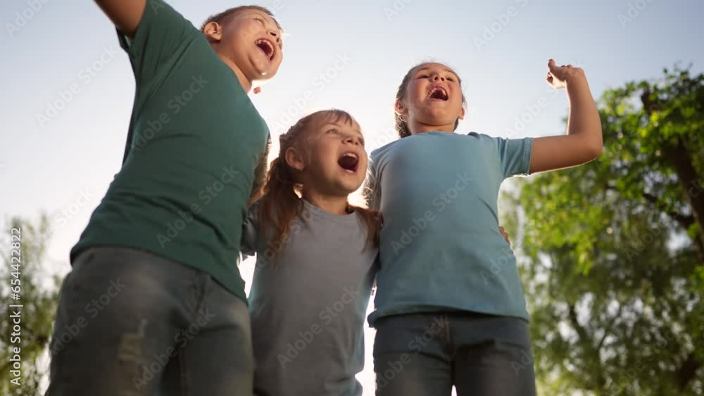 group of children jumping shouting rejoicing. happy family a kid dream ...