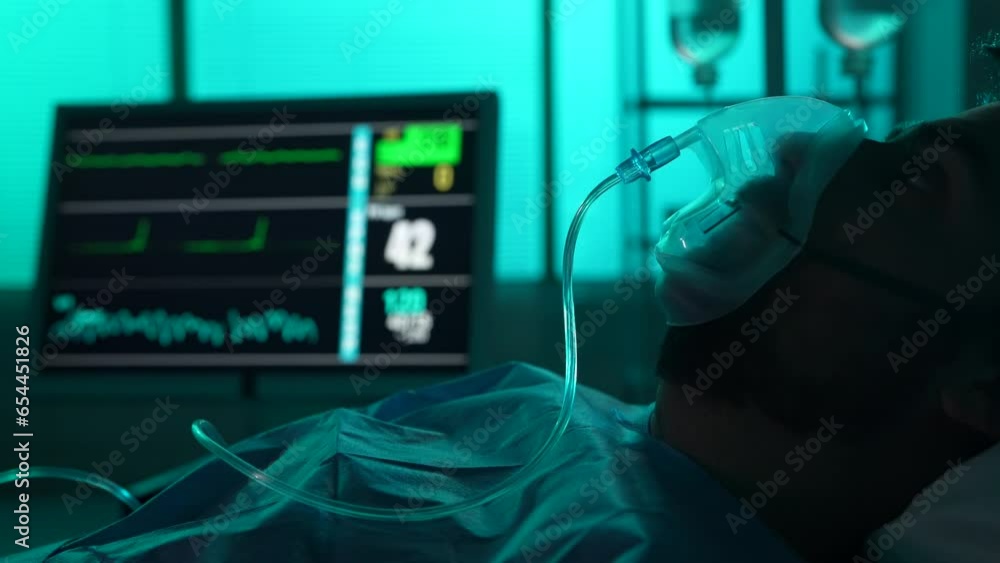 Close-up detail video of a patient on breathing support dying in a ...