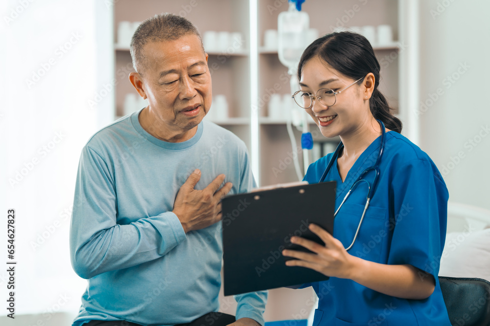 Elderly man engages in thoughtful discussion with compassionate asian ...