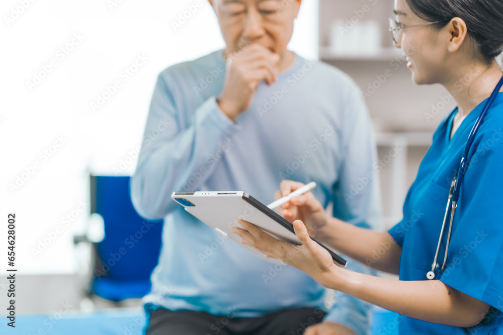 Elderly man engages in thoughtful discussion with compassionate asian ...