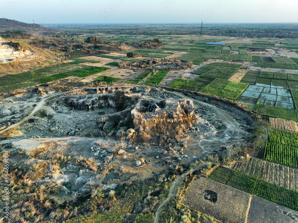Aerial view of the Limestone mining area with farmers' rice fields in ...