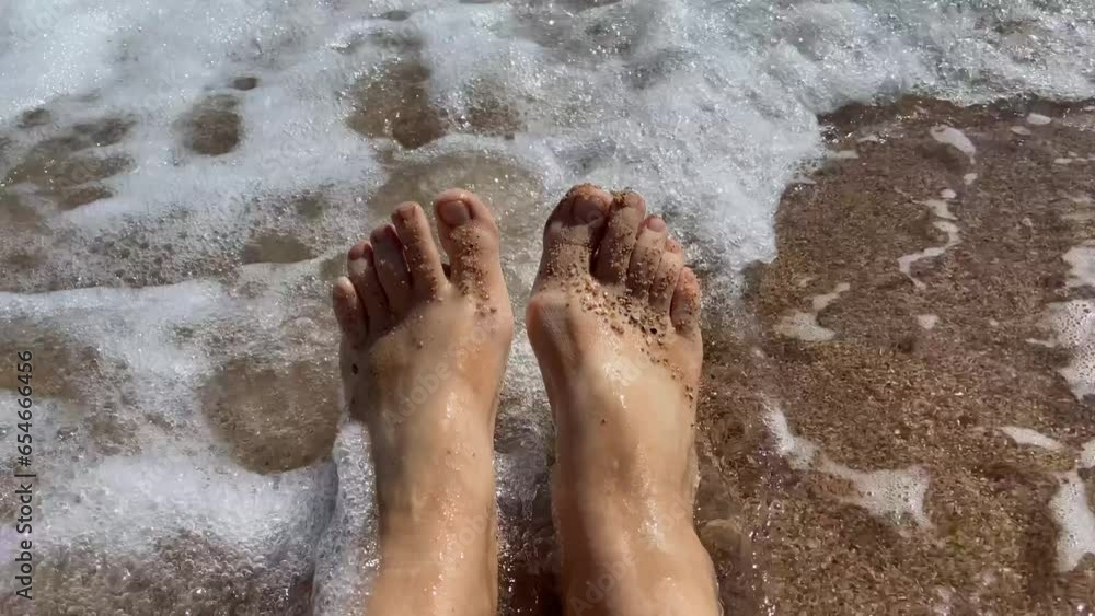 woman legs on sand beach with waving sea, female legs with problem with ...