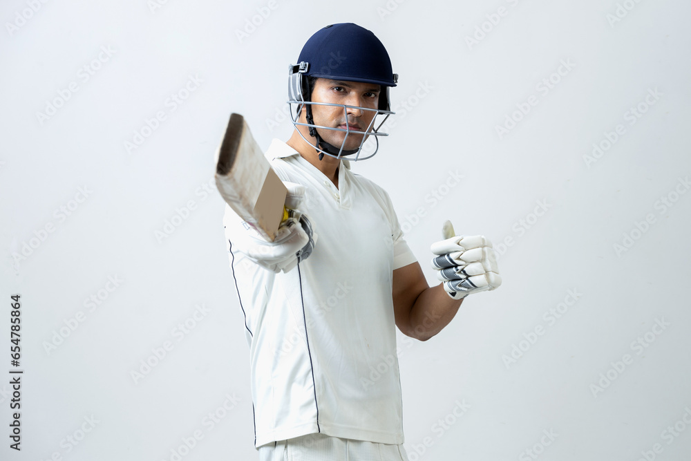 Indian cricketer lifting cricket bat towards the camera and celebrating ...
