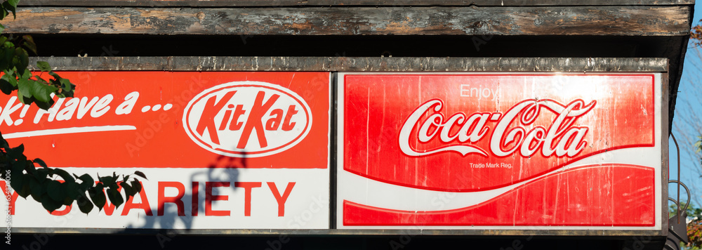 old variety shop with sponsor signs including Kit Kat and Coca-cola ...