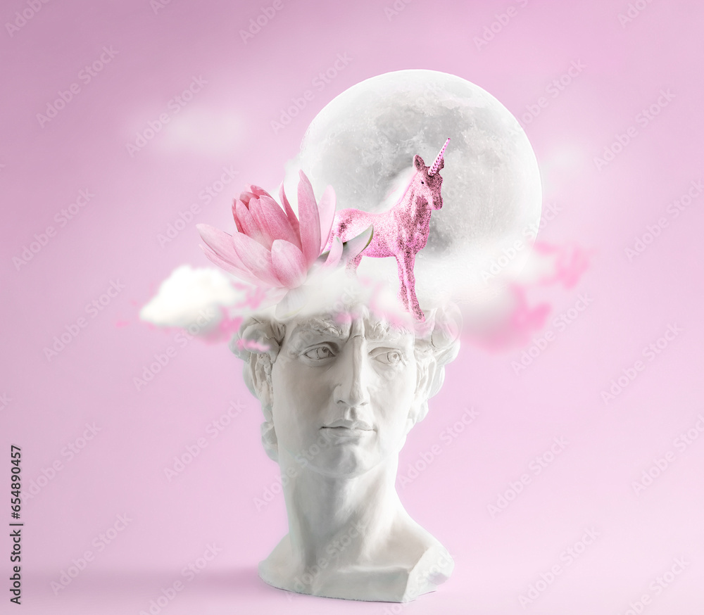 David head with lotus, unicorn and full moon on its head on pastel pink ...