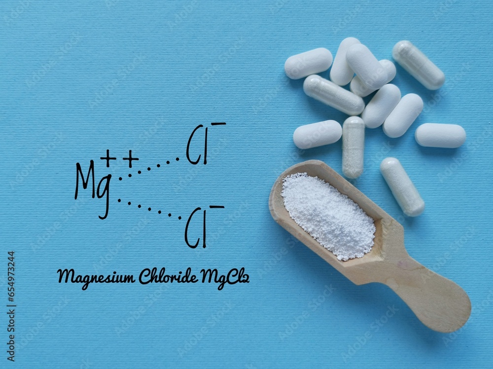 Structural chemical formula of magnesium chloride with white pills and ...
