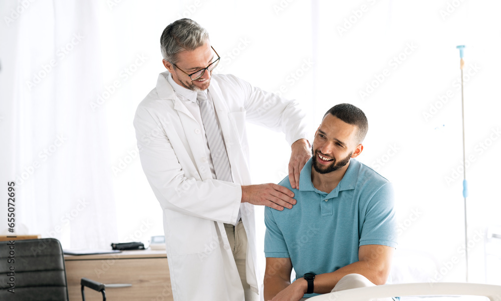 Doctor, men and consultation with conversation, healthcare and ...