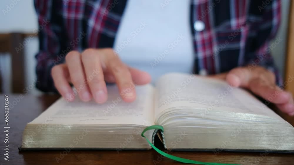 Woman reading the Bible praying in a position of devotion to God and ...