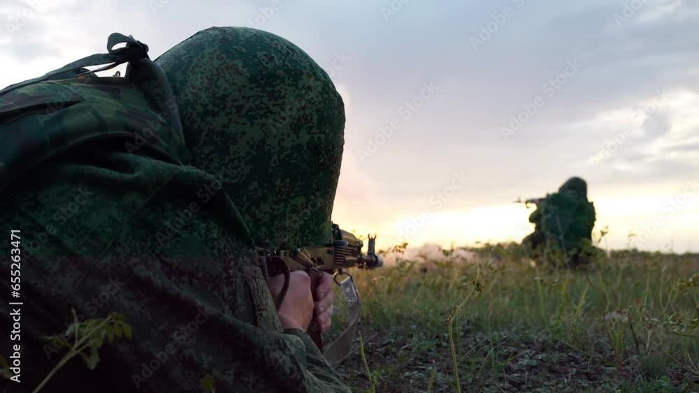 Team of soldiers fight enemy and shoot lying in ambush, military action ...