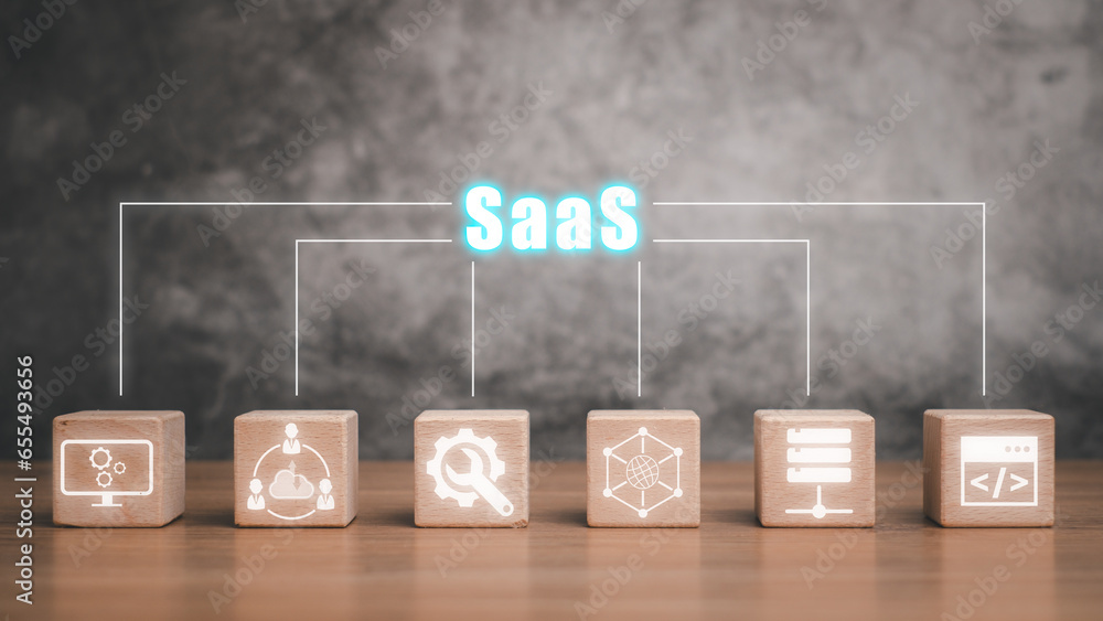 SaaS, software as a service concept, Wooden block on desk with software ...