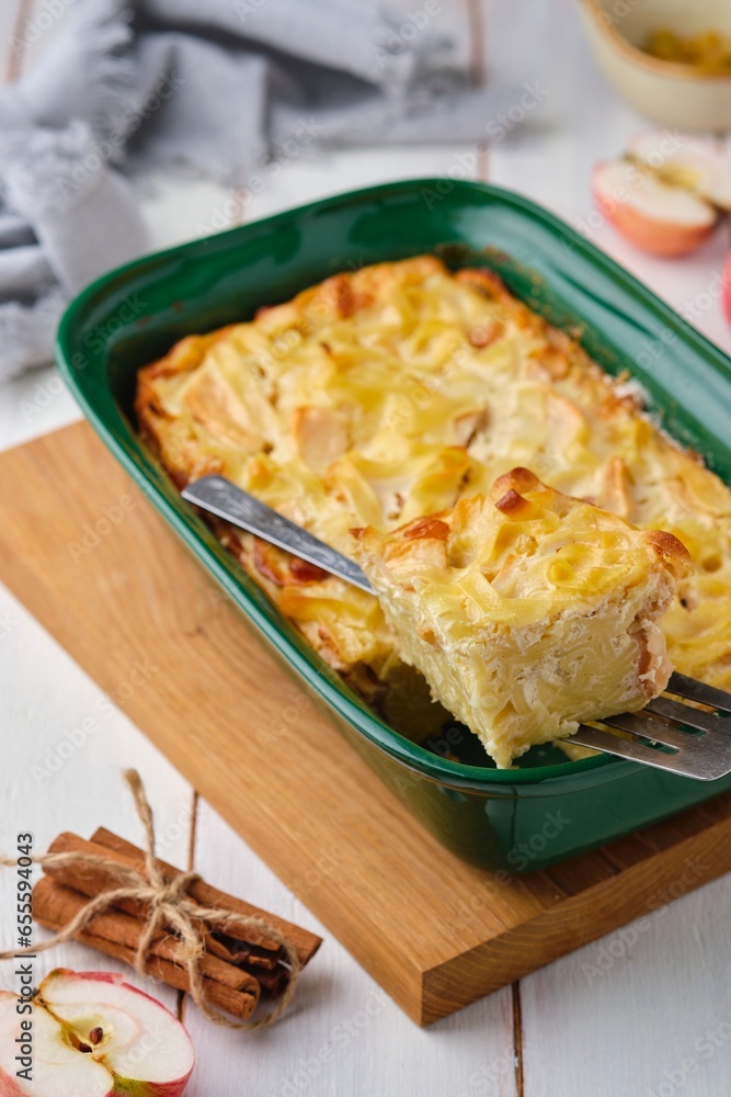 Kugel, a casserole of noodles, cottage cheese, apples and raisins in a ...
