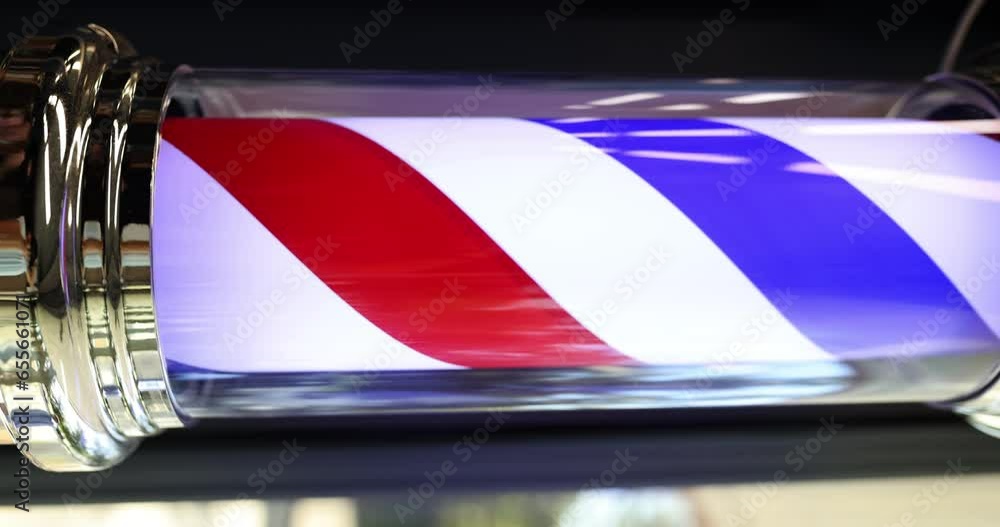 Red white and blue barber pole on side of building. Barber shop ...