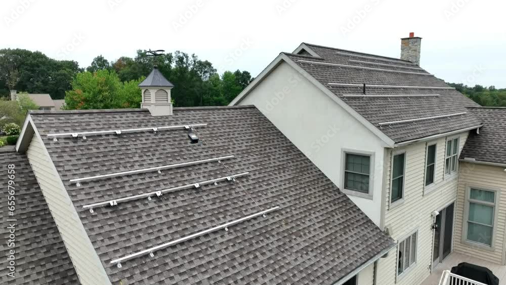 Metal tracks installed on shingle roof of USA house prepped for solar ...