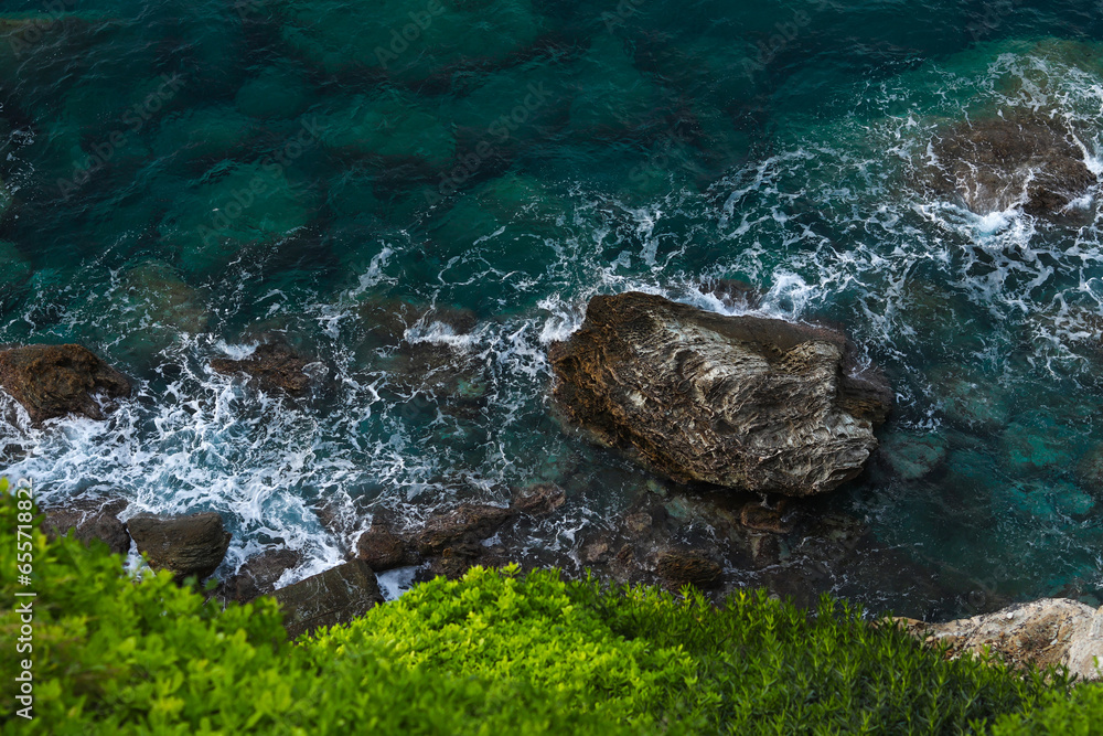 A top down aerial view of rocks and sea. A stunning visual perspective ...