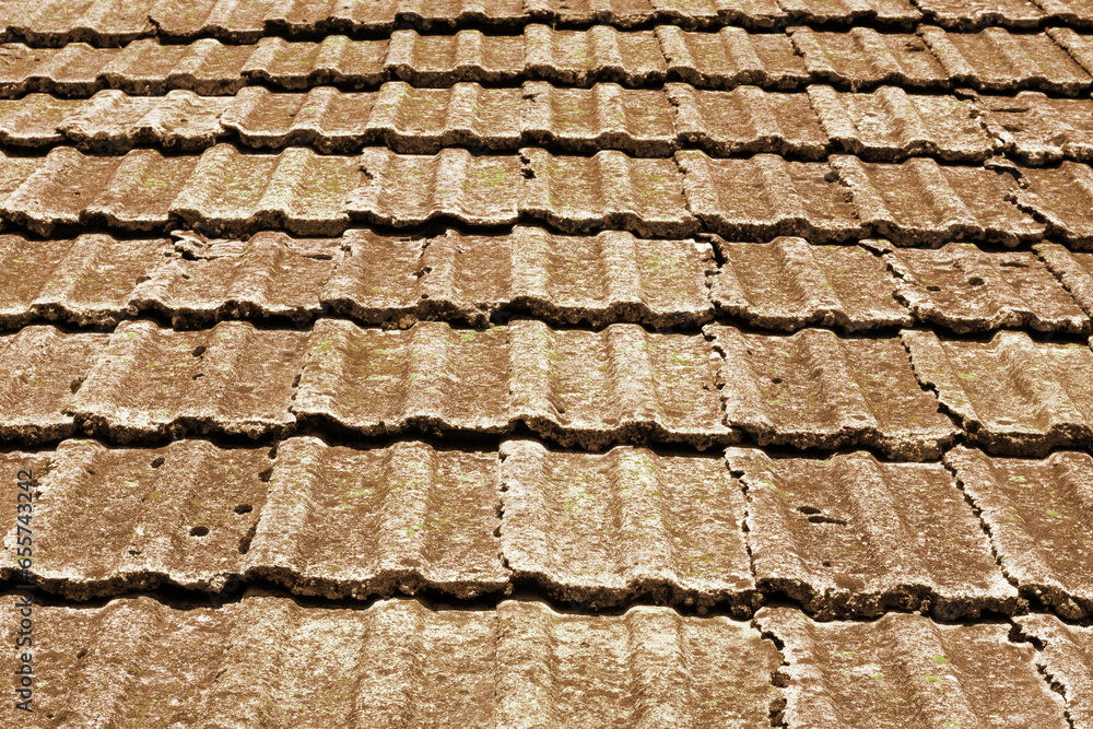 Brown concrete roof tiles. Old style architecture. Countryside house ...