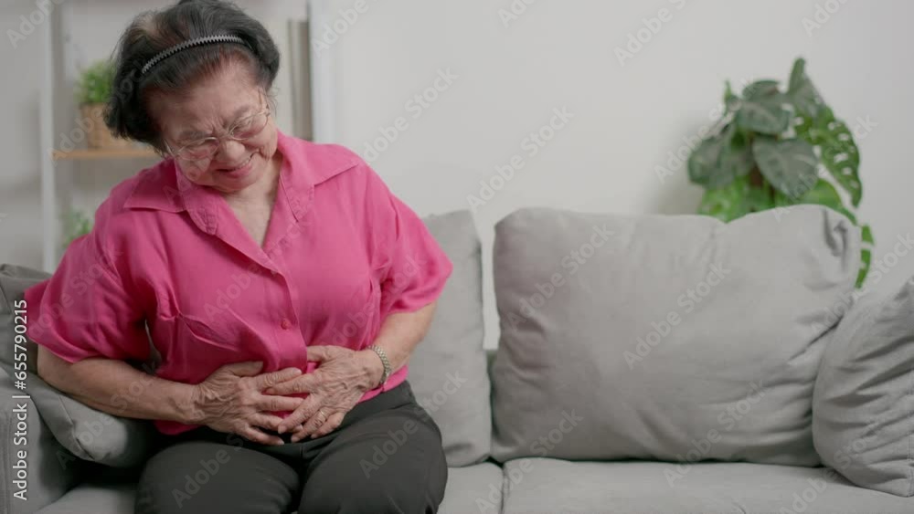 Unhealthy mature woman holding belly ,severe stomach ache caused by ...