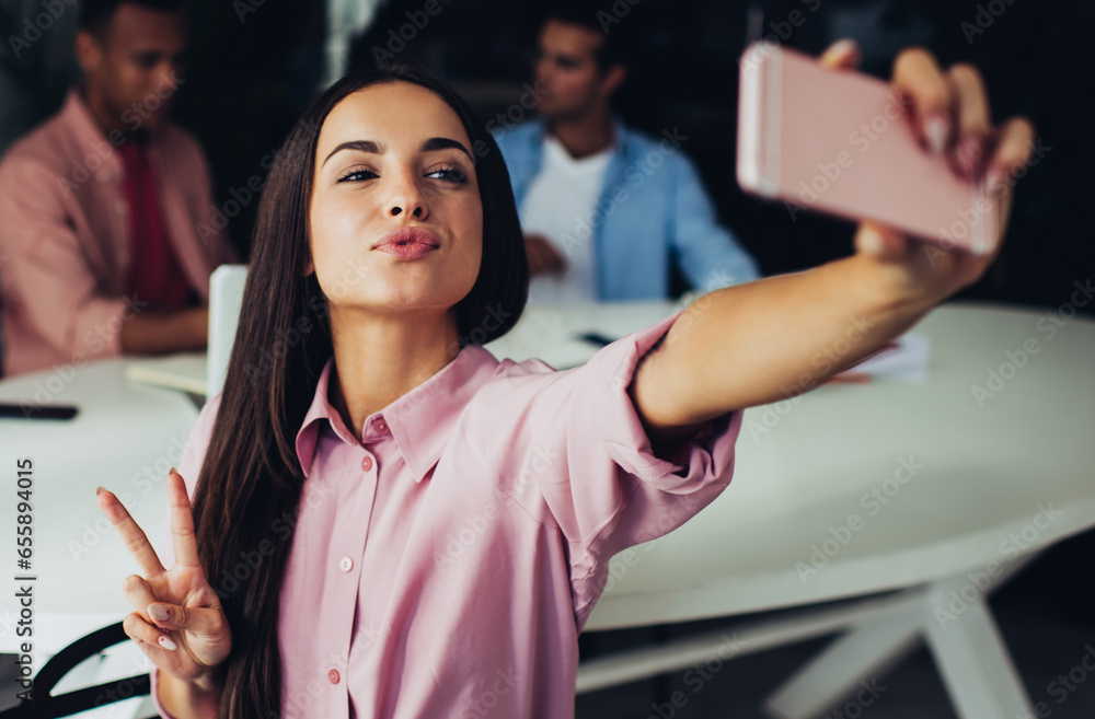 Caucasian hipster girl with duck face clicking selfie photos via modern ...