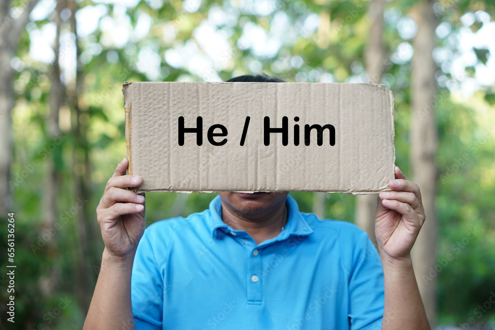 Man holds paper card with words He Him. Concept, Personal Pronoun words ...
