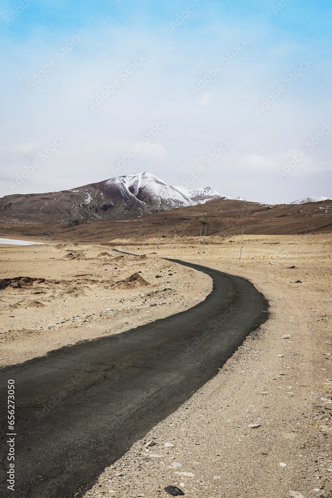 Curvy asphalt road through Ladakh's barren valley: a solo road trip ...
