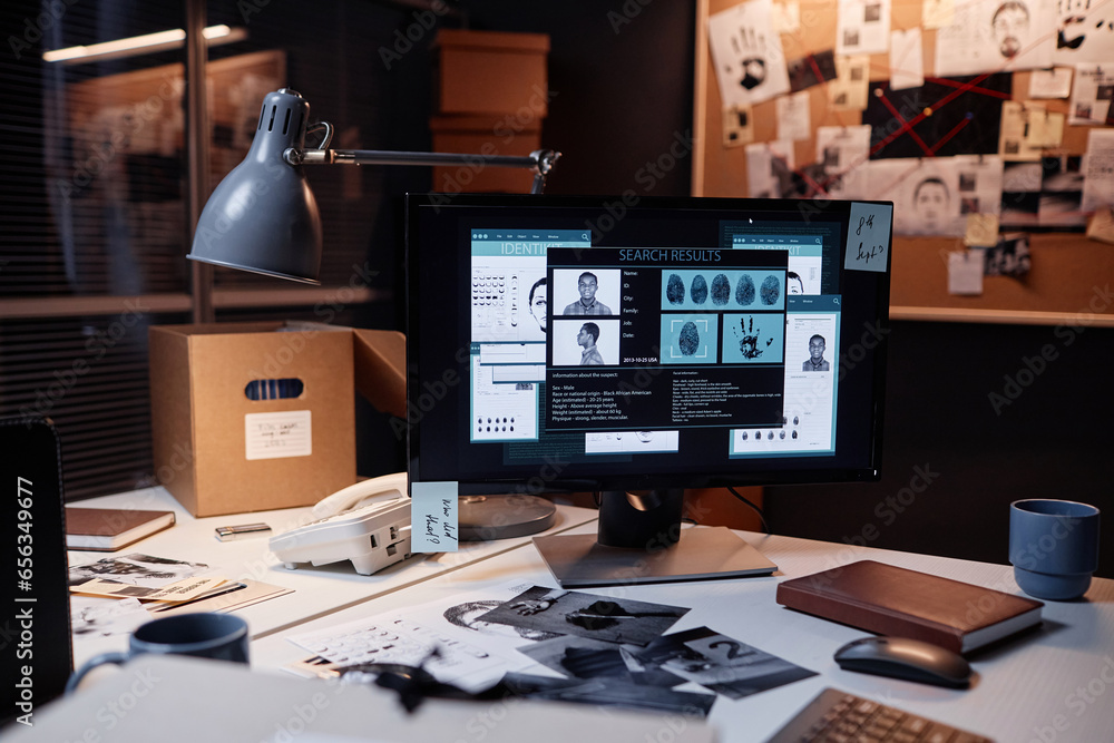 Background image of computer with personal file on desk in detectives ...