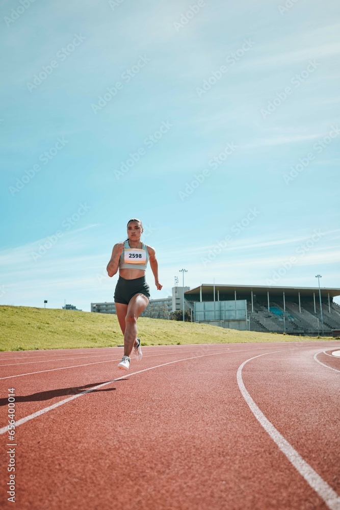 Woman, athlete and running on stadium track in fitness, workout or ...