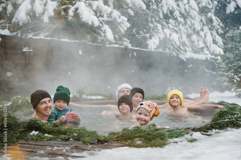 Winter holidays in mountains, hot water treatments concept. Friends in ...