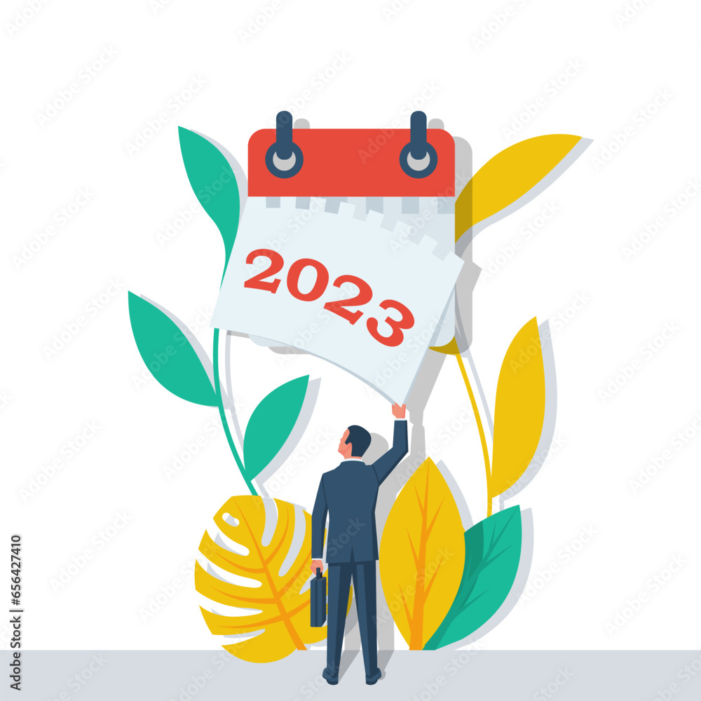 Goodbye 2023. A businessman tears off a calendar sheet of the outgoing ...