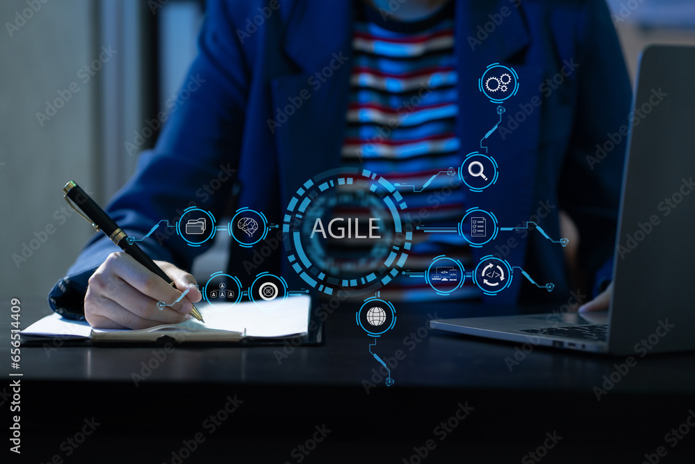 Agile development methodology concept. Business hand using laptop ...