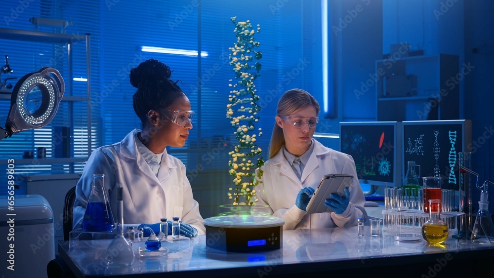 Medium-sized photo capturing two female scientists wearing glasses and ...