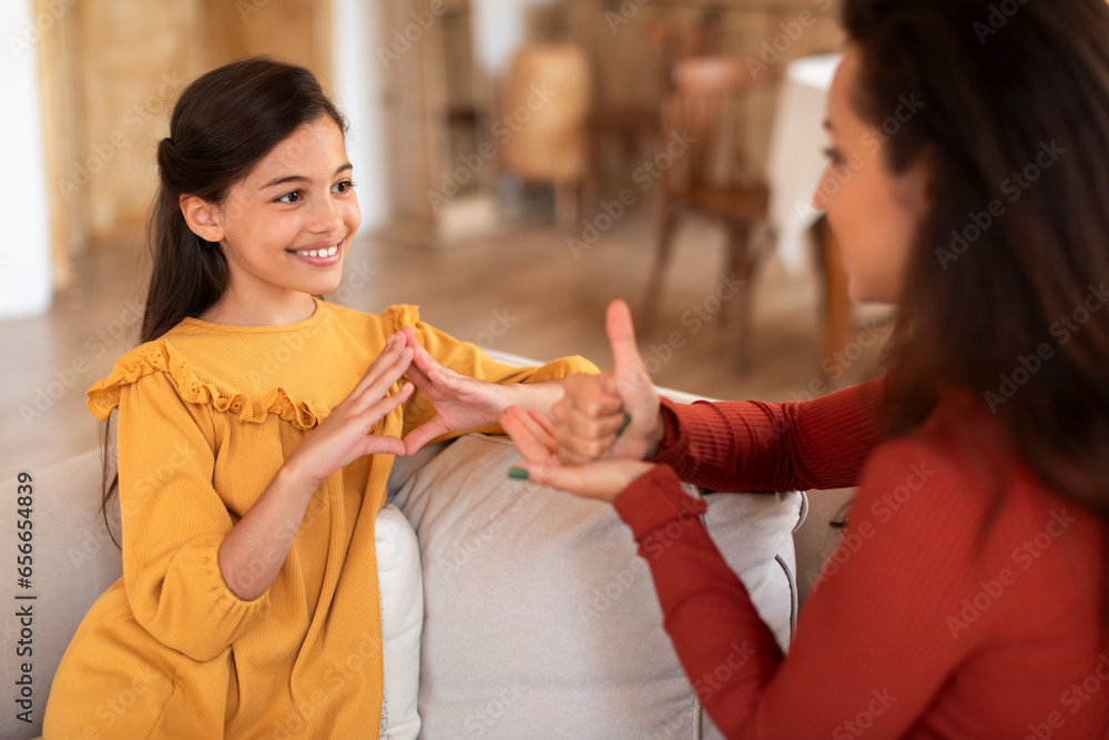 Girl Making Hand Gesture Using Sign Language With Tutor Indoor Stock ...