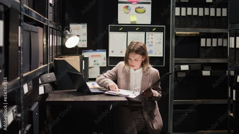 Law officer entering room, using laptop to analyze clues and perform ...