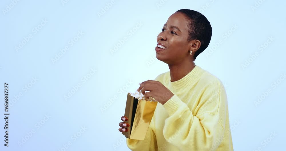 African woman, popcorn and laugh in studio, comedy and happy with ...