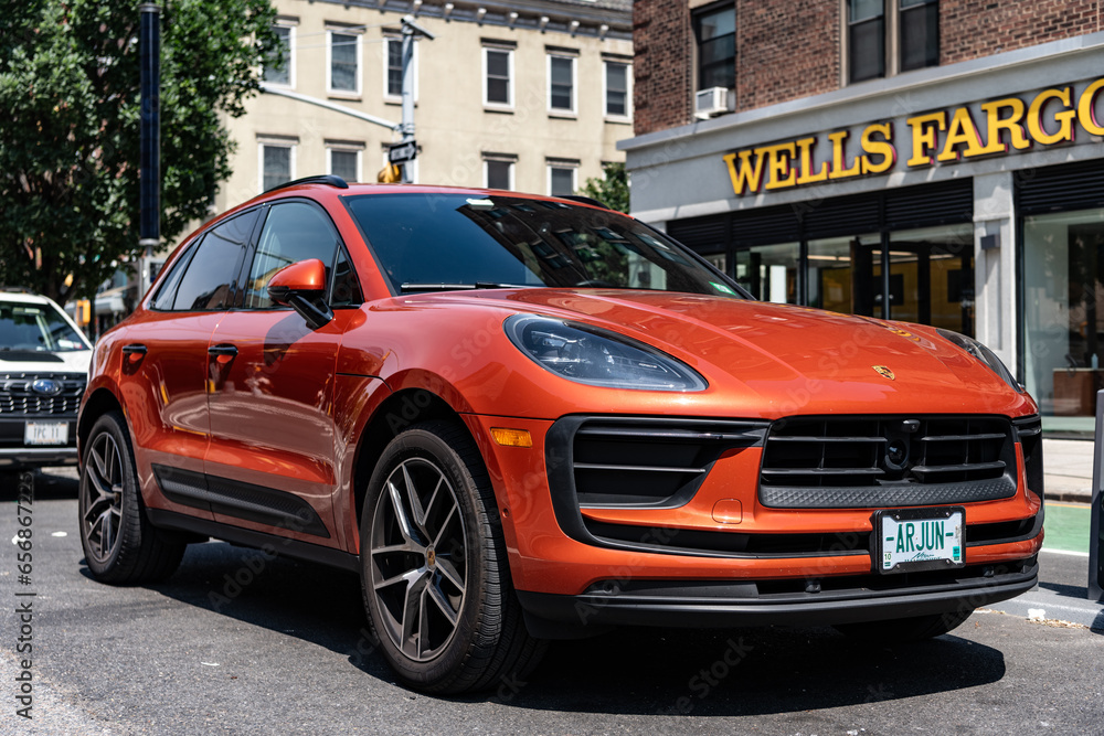 New York City, USA - August 05, 2023: 2023 Porsche Macan T SUV Ruby red ...