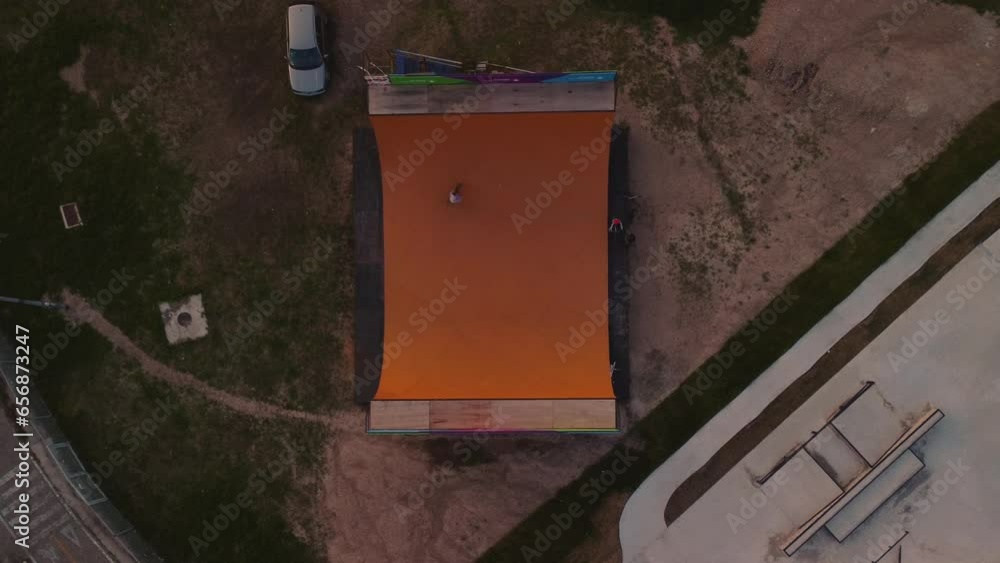 Bmx rider riding on an orange halfpipe ramp, top view Stock Video ...