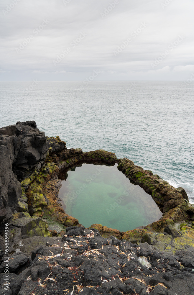 Brimketill lava rock pool in Iceland Stock Photo | Adobe Stock